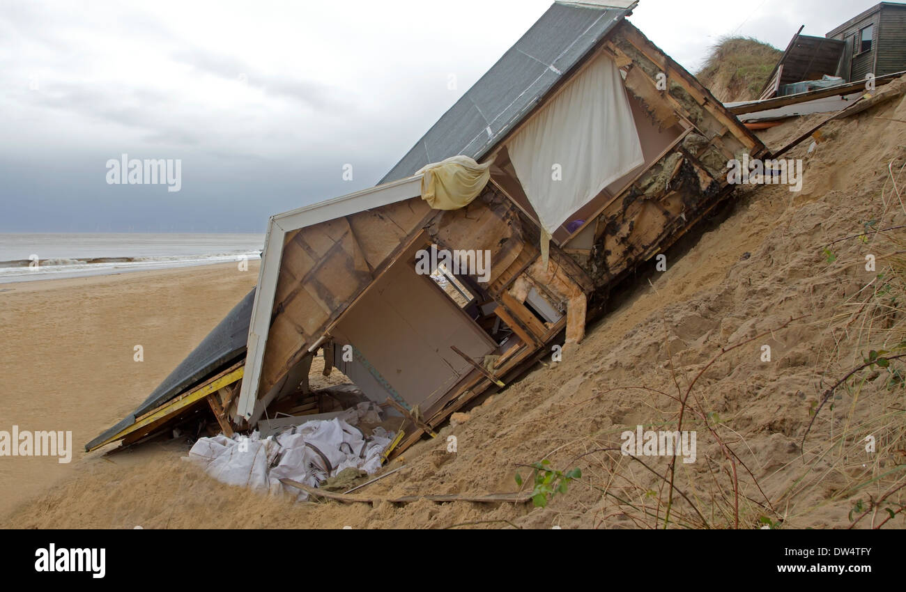 Eroded cliffs and damaged chalets following tidal surges of December ...