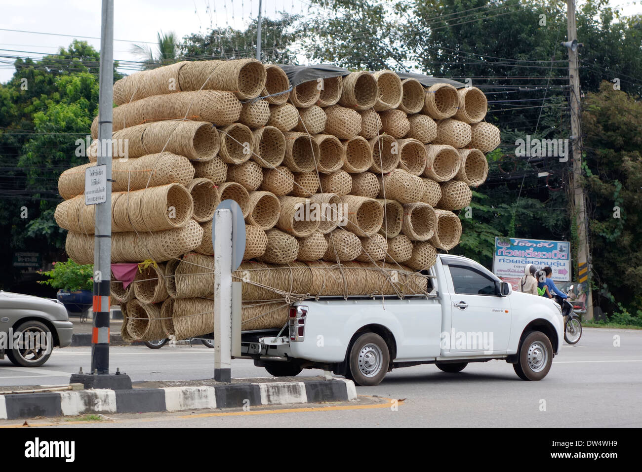 Pickup truck carrying a huge load of woven baskets, Northern Thailand ...