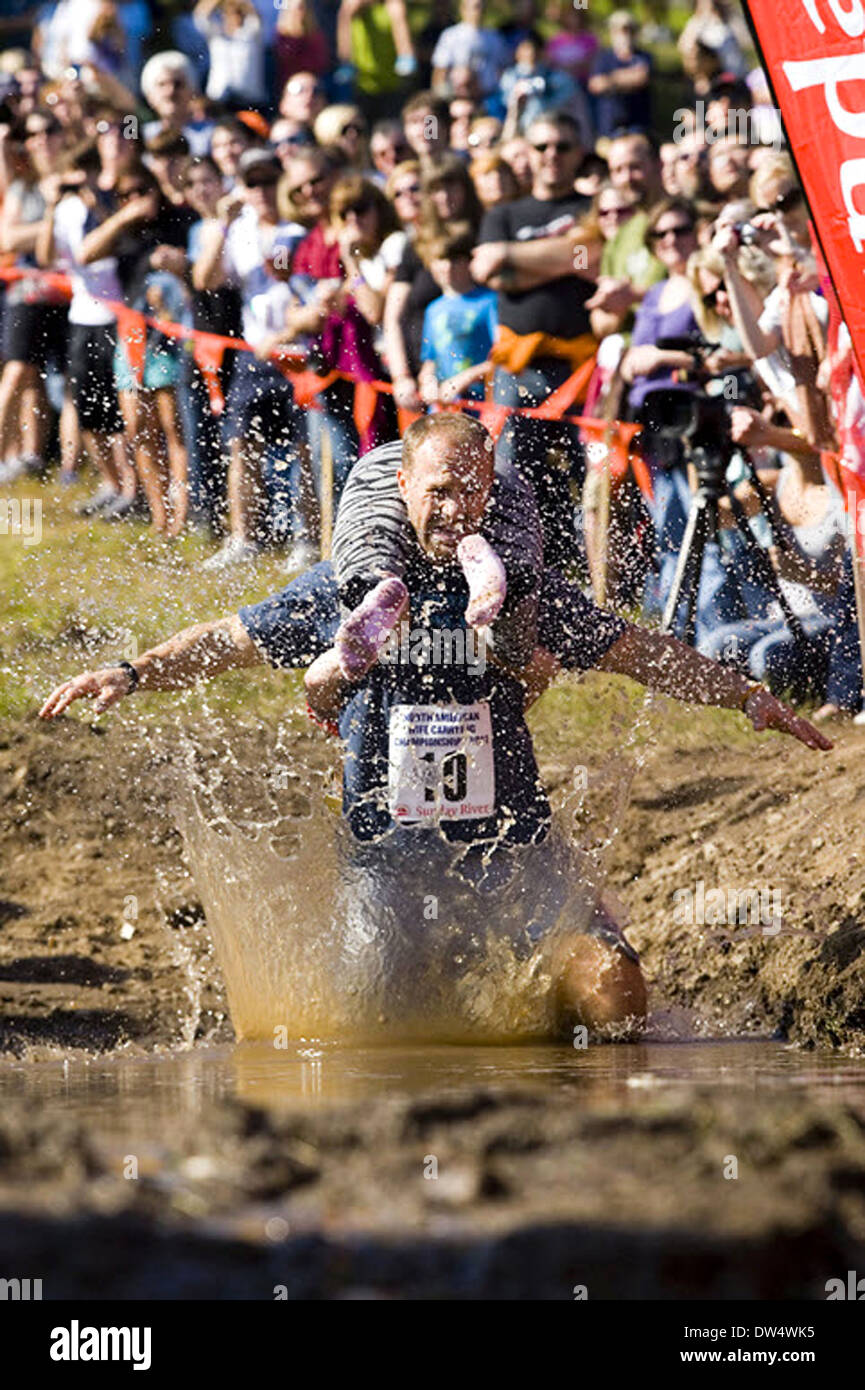 WIFE CARRYING COMPETITION These men really know how to sweep a girl off ...