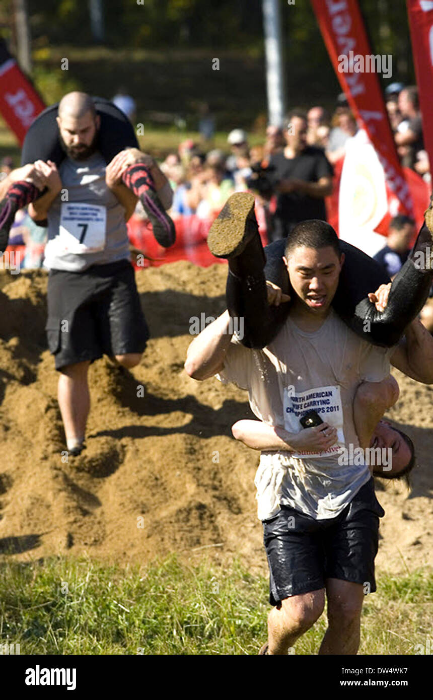 WIFE CARRYING COMPETITION These men really know how to sweep a girl off ...