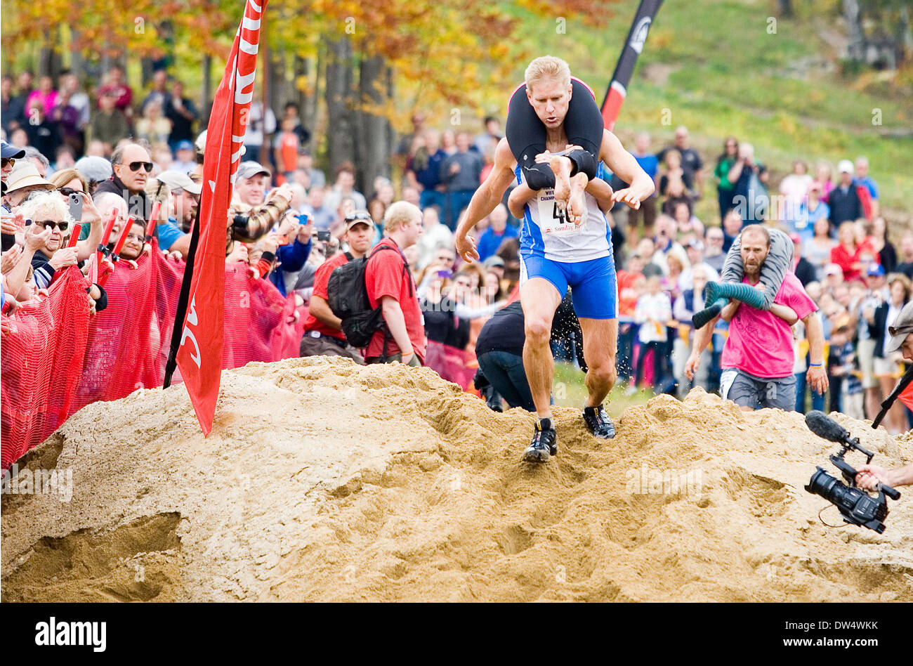 WIFE CARRYING COMPETITION These men really know how to sweep a girl off ...