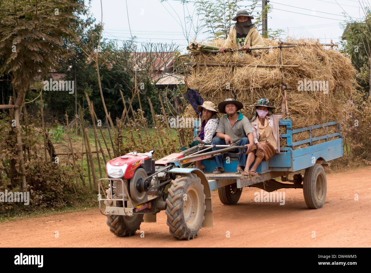 Farmers using two wheel tractor transport hi-res stock photography and ...