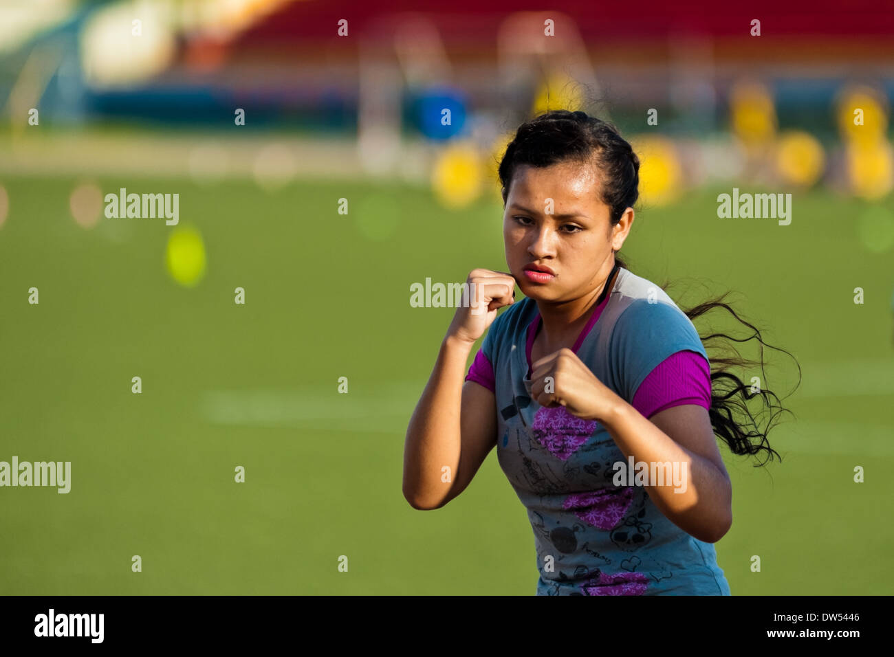 A young Peruvian girl practices shadowboxing while training in the ...