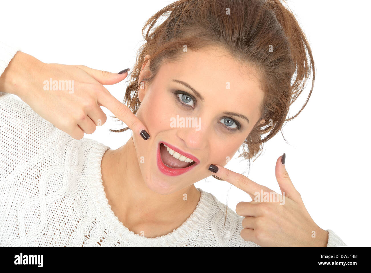 Happy Young Woman Pointing to Teeth Stock Photo - Alamy