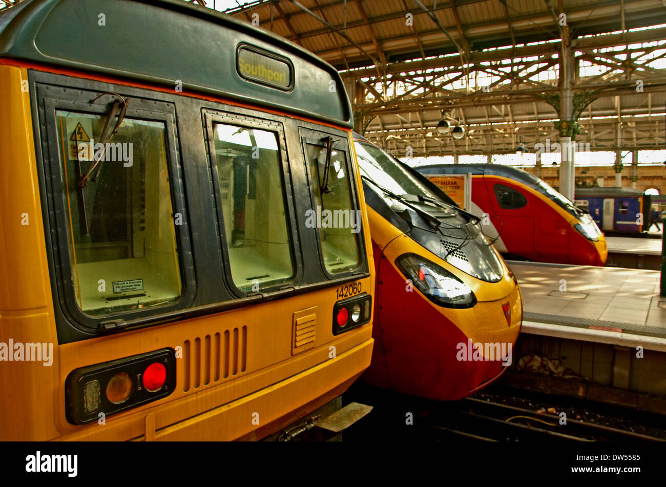 Passenger trains waiting in a station platforms at Manchester ...