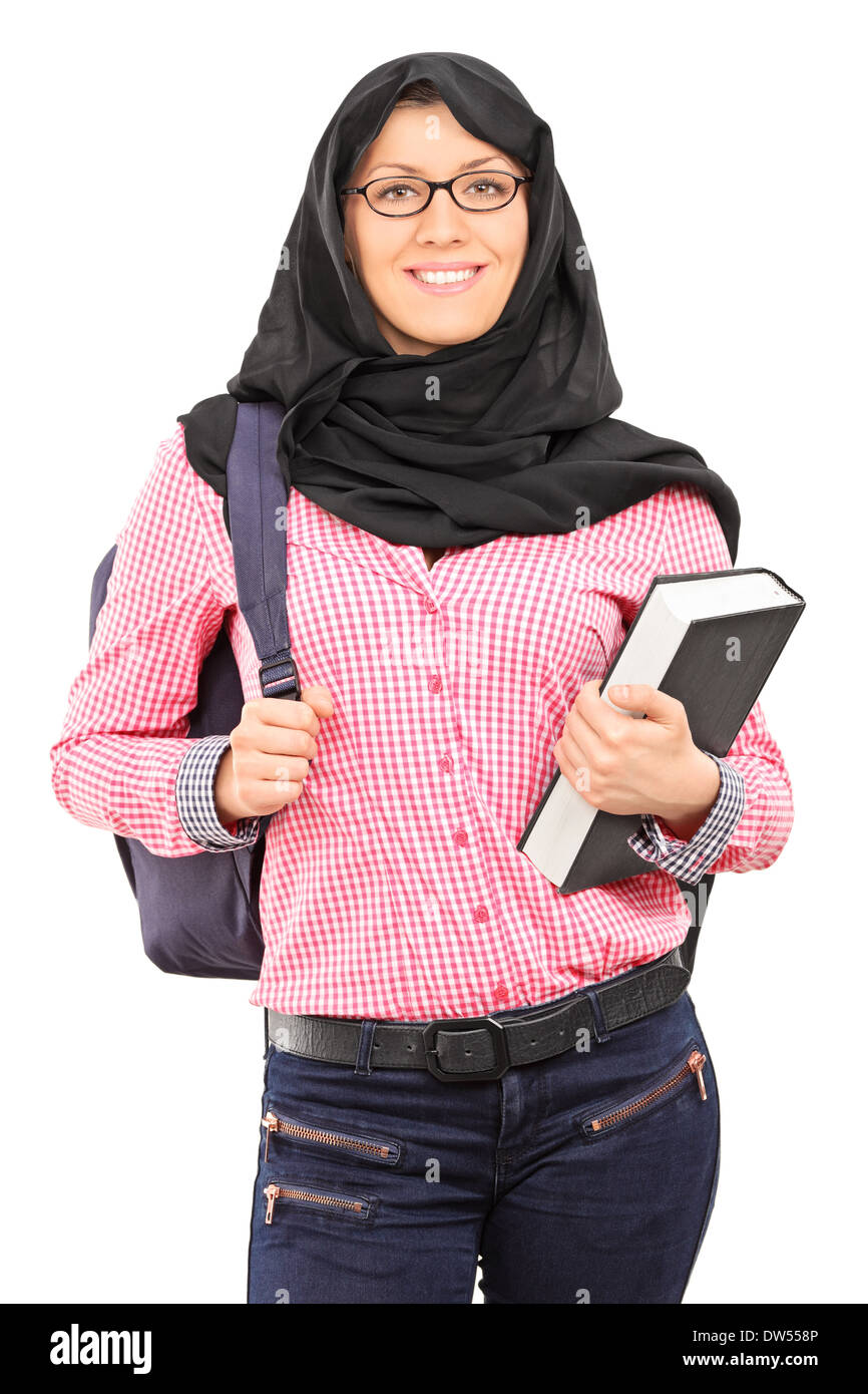Muslim female student with backpack holding a book Stock Photo - Alamy
