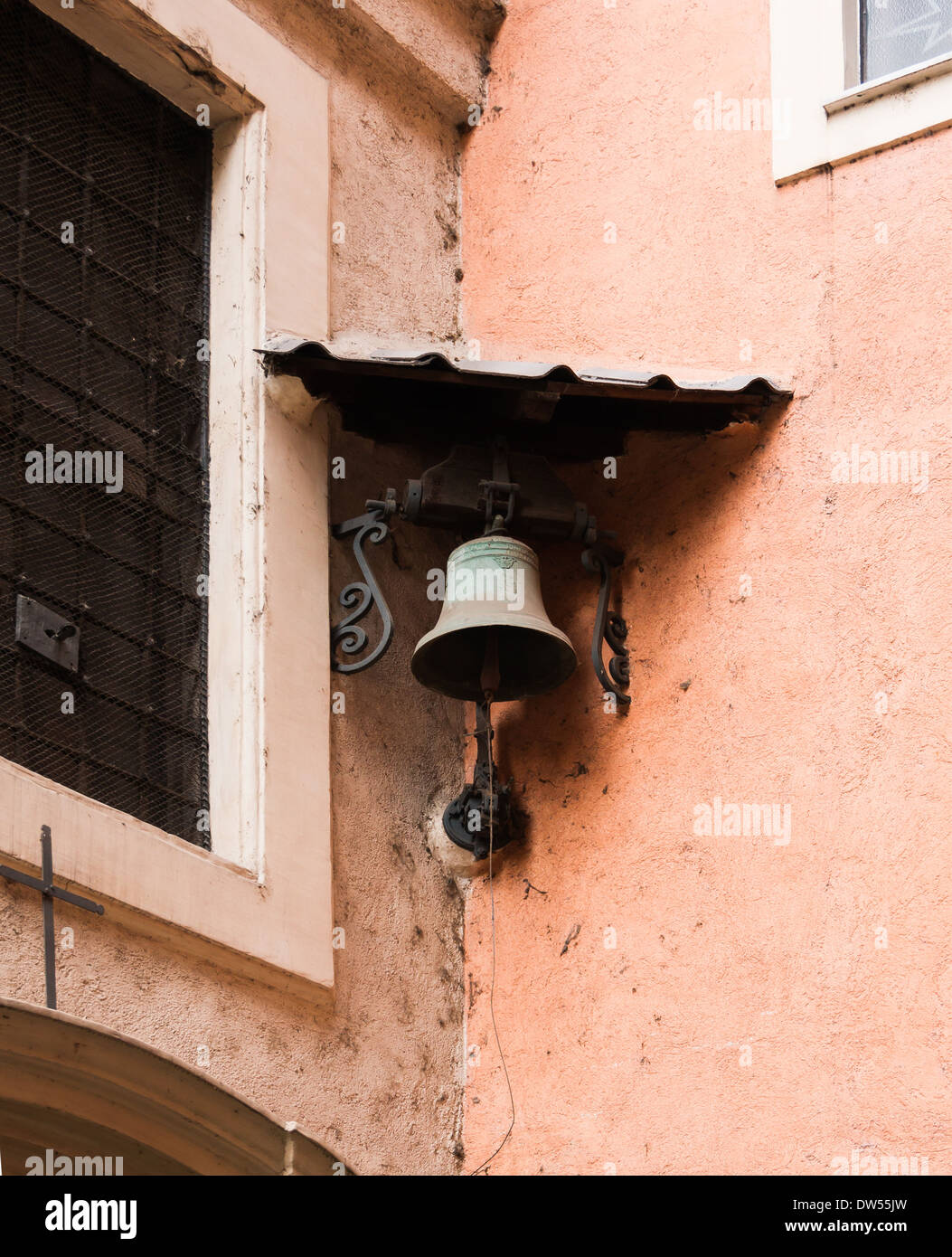 The bell at the entry of a monastery in Rome, Italy, is a symbol of ...
