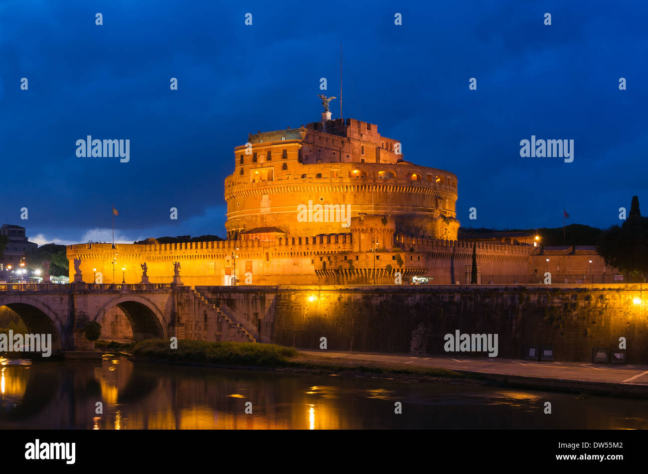 Castel Sant'Angelo in Rome is shown during dusk, with the setting sun ...