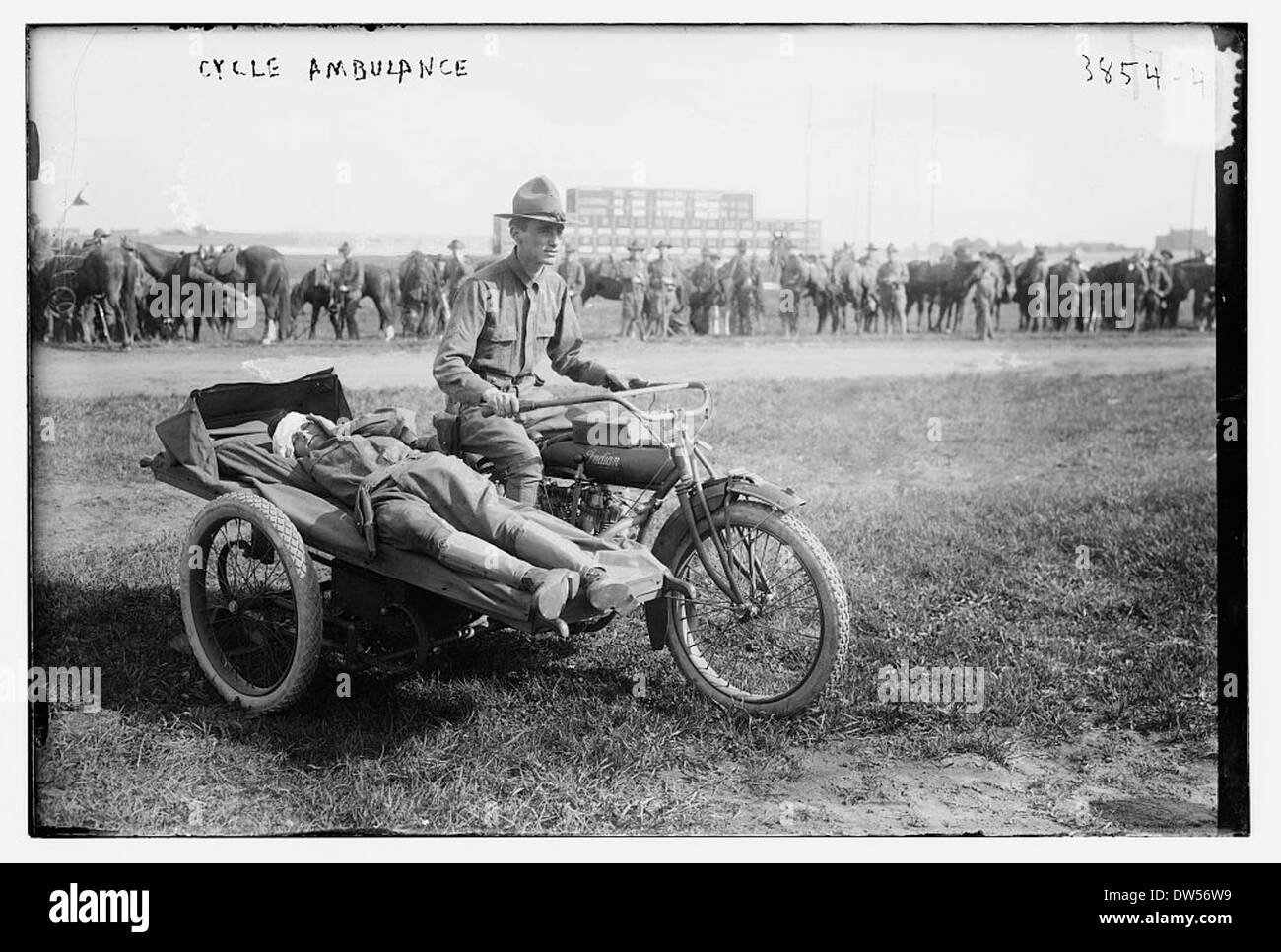 This photograph depicts an early cycle ambulance, a precursor to modern ...