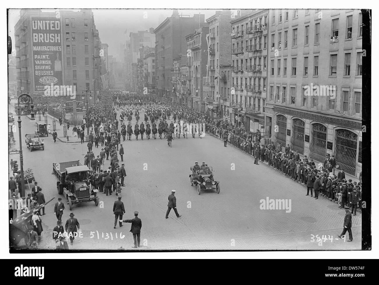 This vintage photograph from 1916 captures a parade, depicting the ...