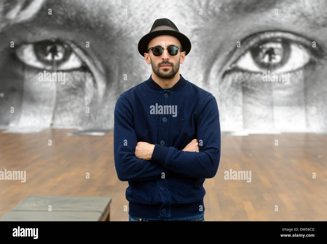 Baden-Baden, Germany. 27th Feb, 2014. The French artist JR stands in ...