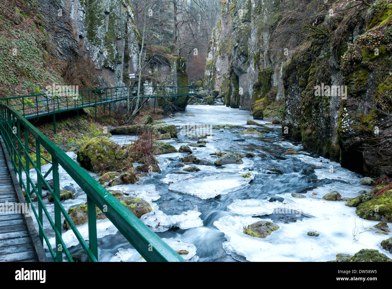 Wooden pathway over mountain river in the winter Stock Photo - Alamy