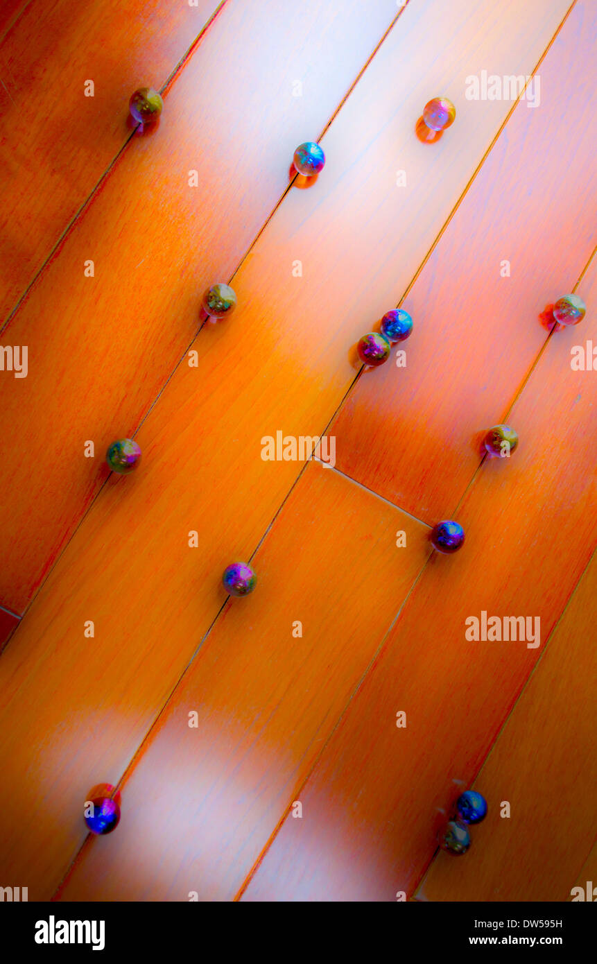 Marbles on a floor following diagonal lines with an artistic effect ...