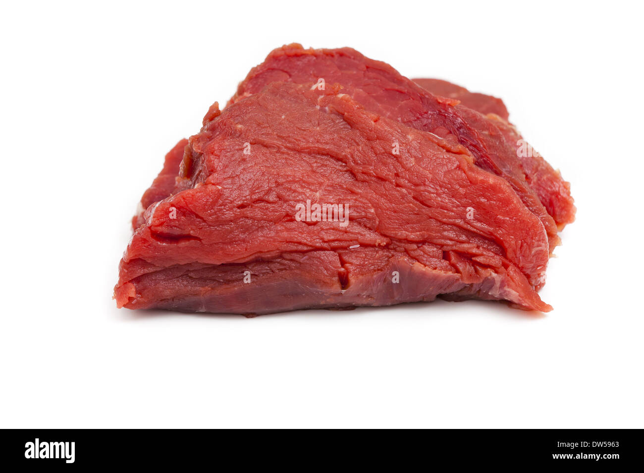 One Piece raw Beef Tenderloin isolated on White Background Stock Photo ...