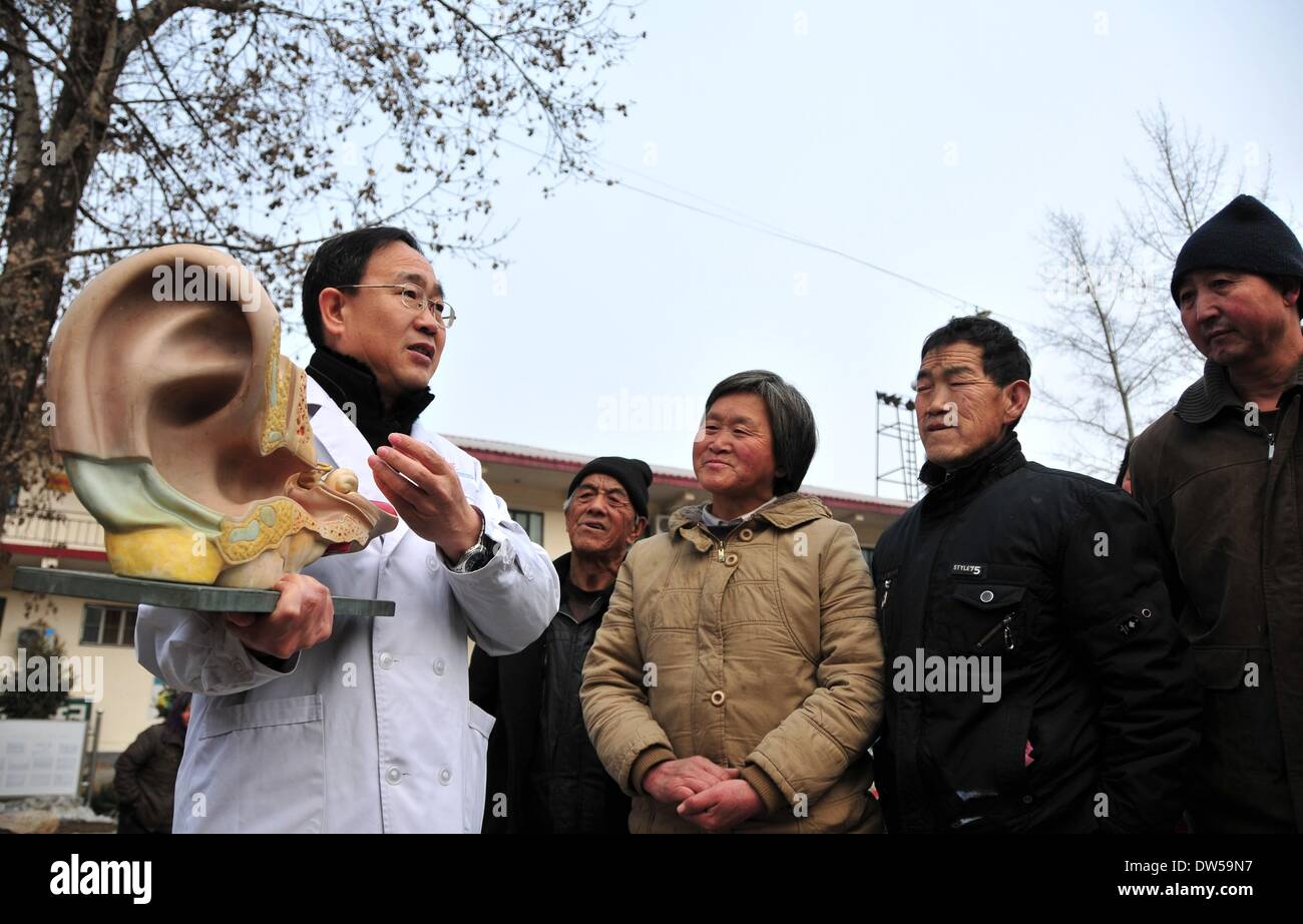 Xingtai, China's Hebei Province. 28th Feb, 2014. An otologist (L) from ...