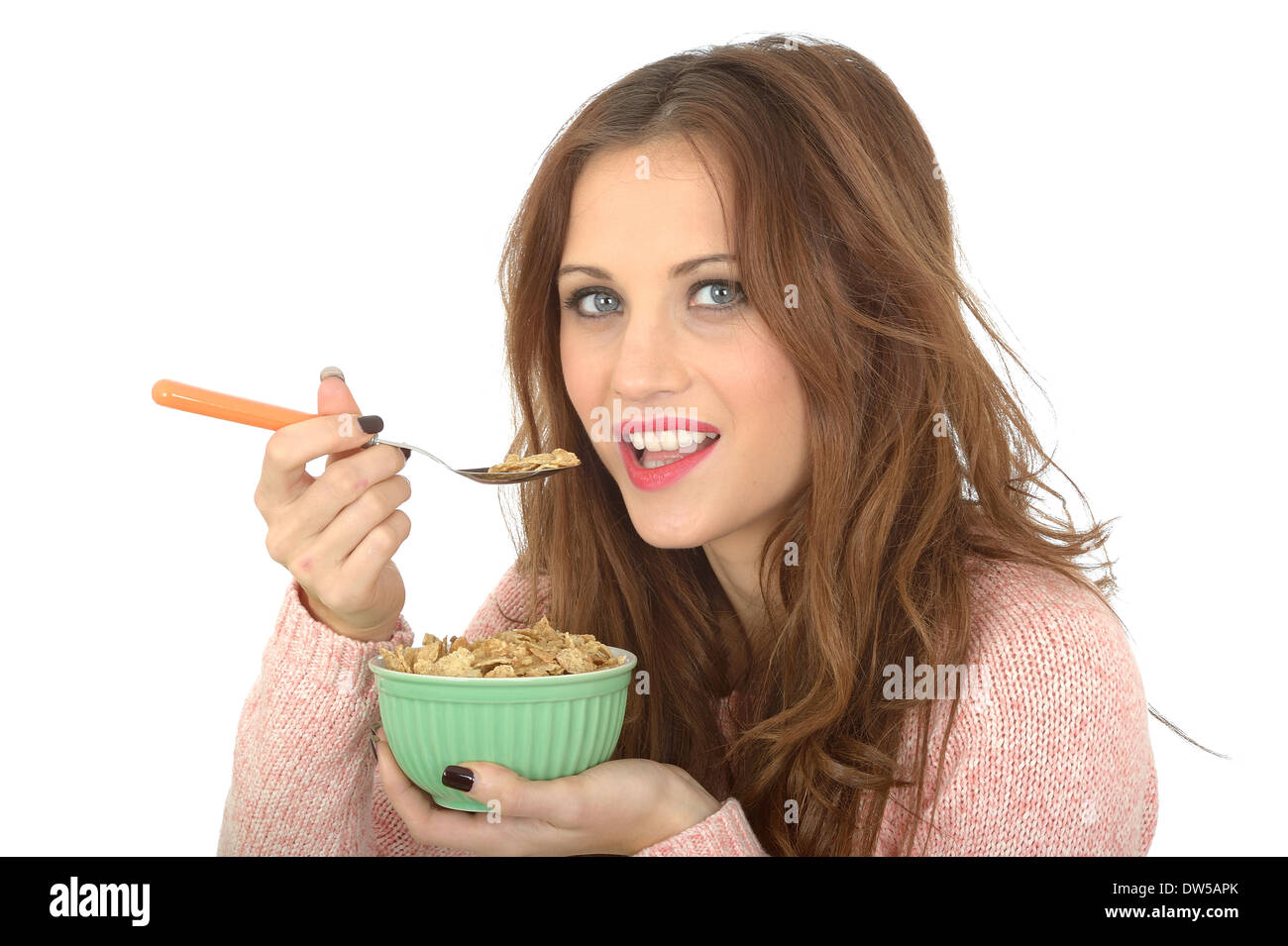 Young Woman Eating Breakfast Cereal Stock Photo - Alamy