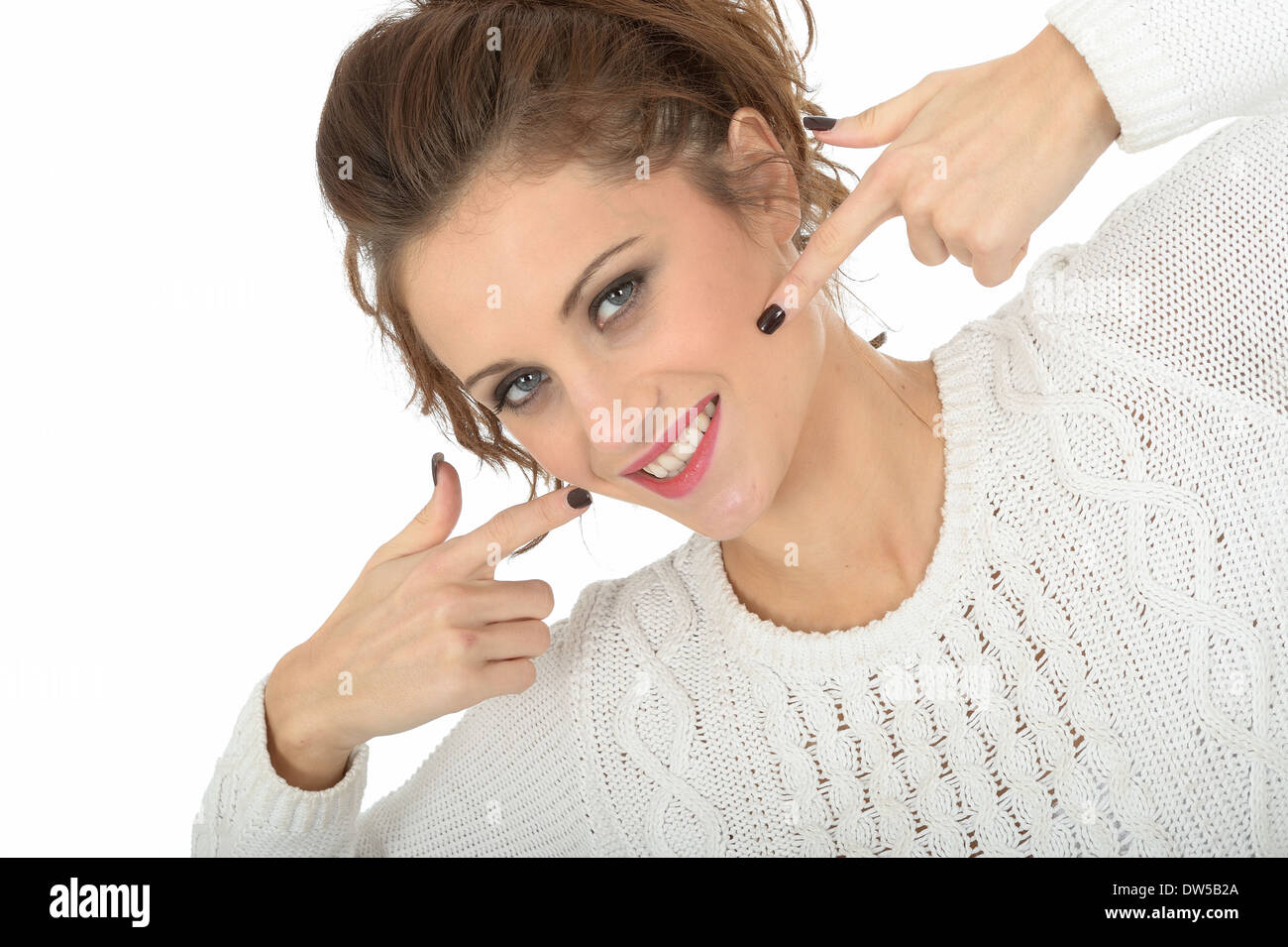 Happy Young Woman Pointing to Teeth Stock Photo - Alamy
