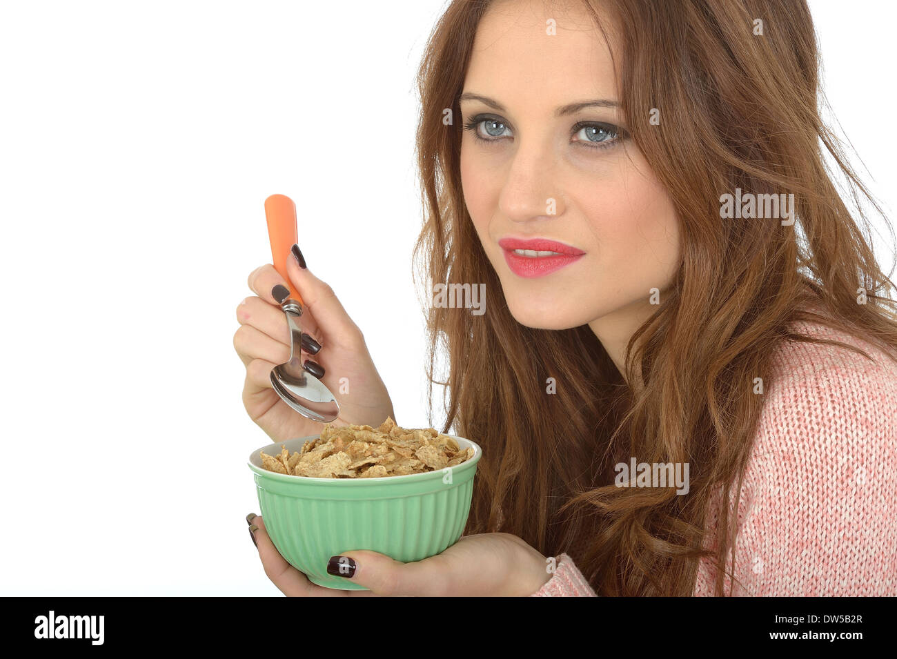 Young Woman Eating Breakfast Cereal Stock Photo - Alamy