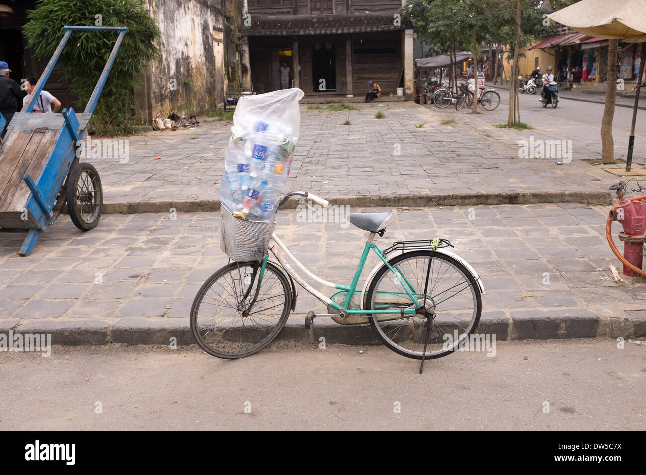 Bicycle collecting plastic bottles for recycling Stock Photo - Alamy