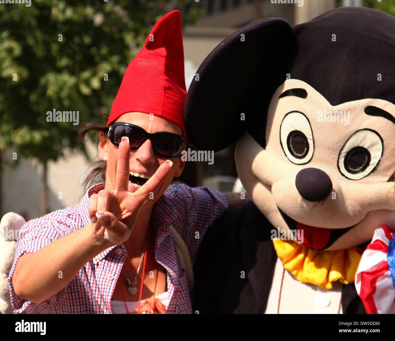 A woman taking part in a hen-party before wedding, poses with Micky ...