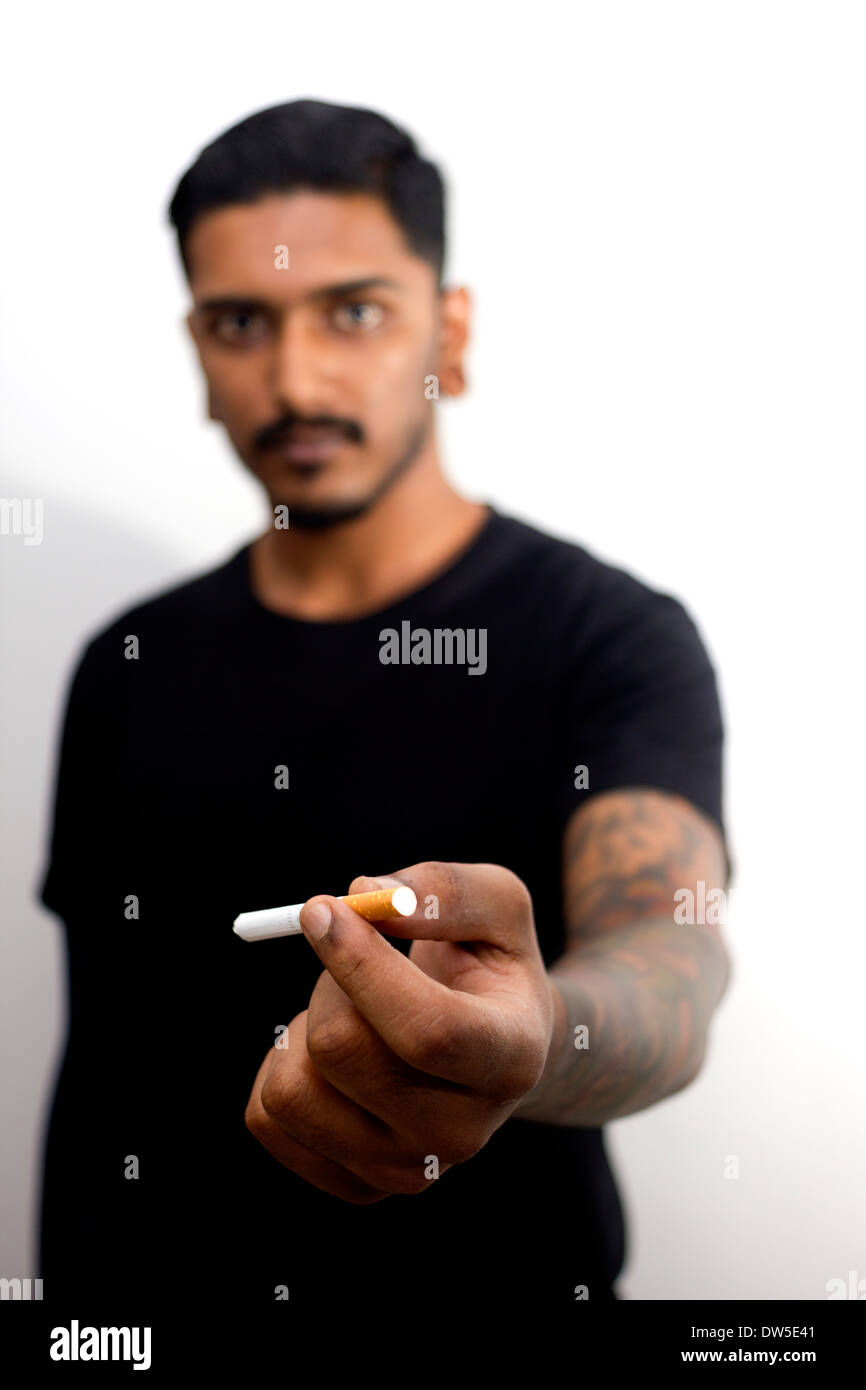 Offering cigarette male hi-res stock photography and images - Alamy