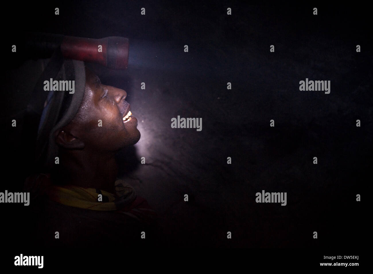 Inside a small-scale Tanzanite mine in Tanzania miners are working ...