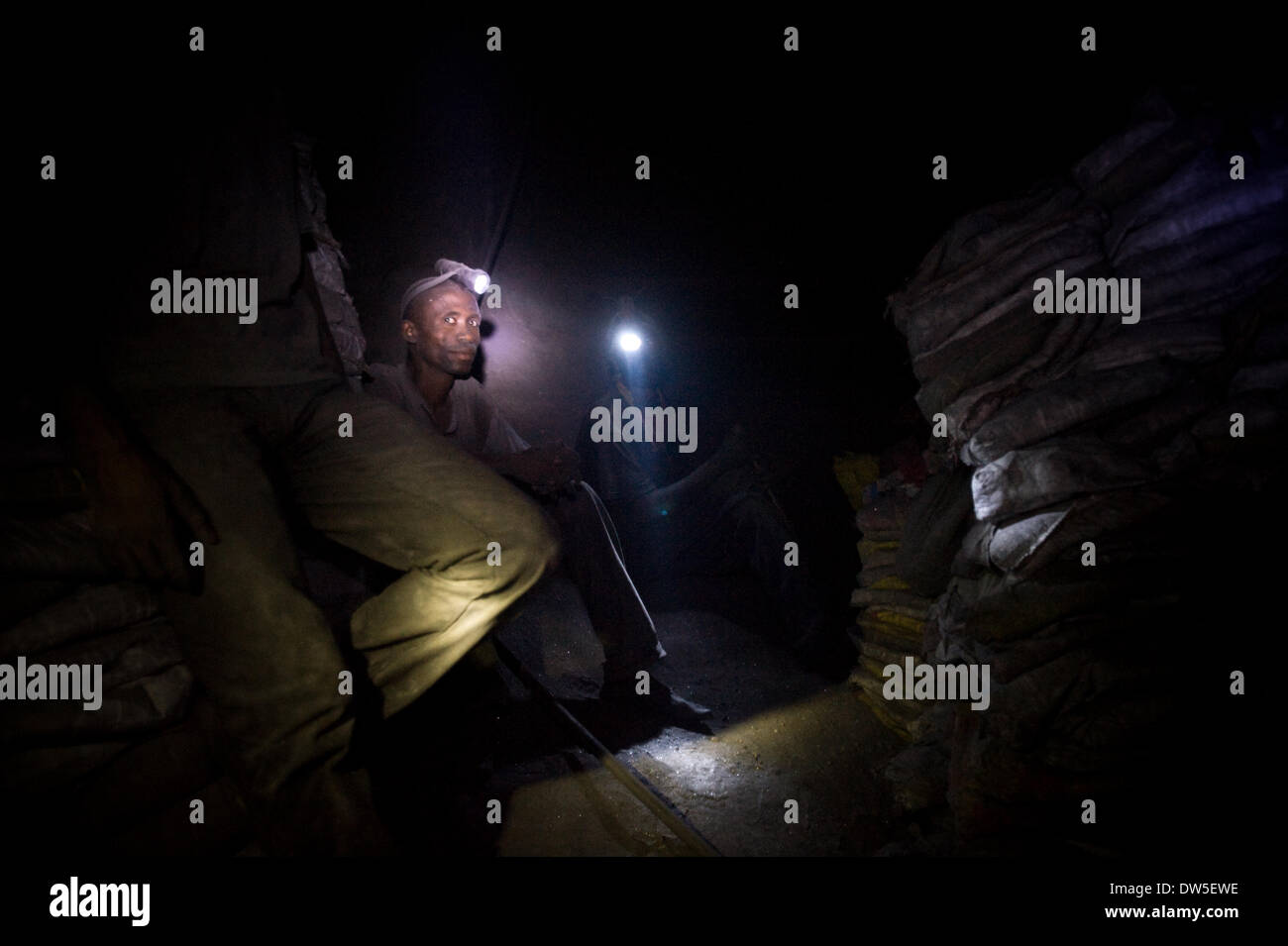 Inside a small-scale Tanzanite mine in Tanzania miners are working ...