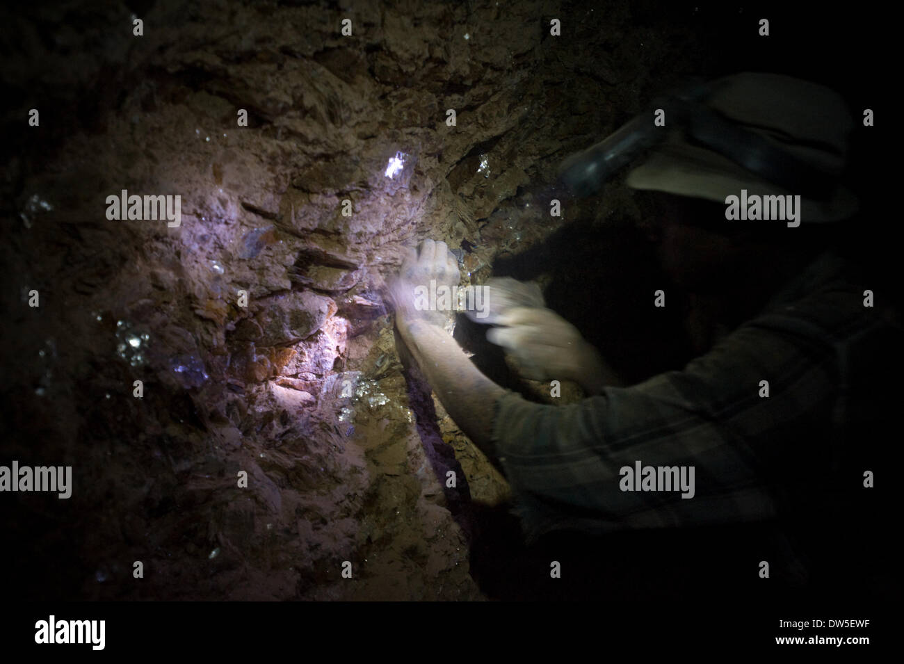 Inside a small-scale Tanzanite mine in Tanzania miners are working ...