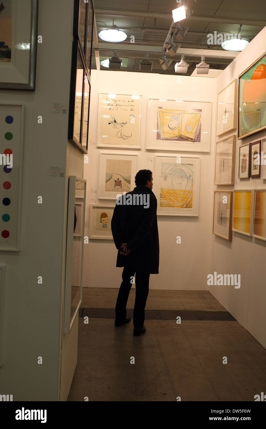 Visitor viewing art in a gallery Stock Photo - Alamy