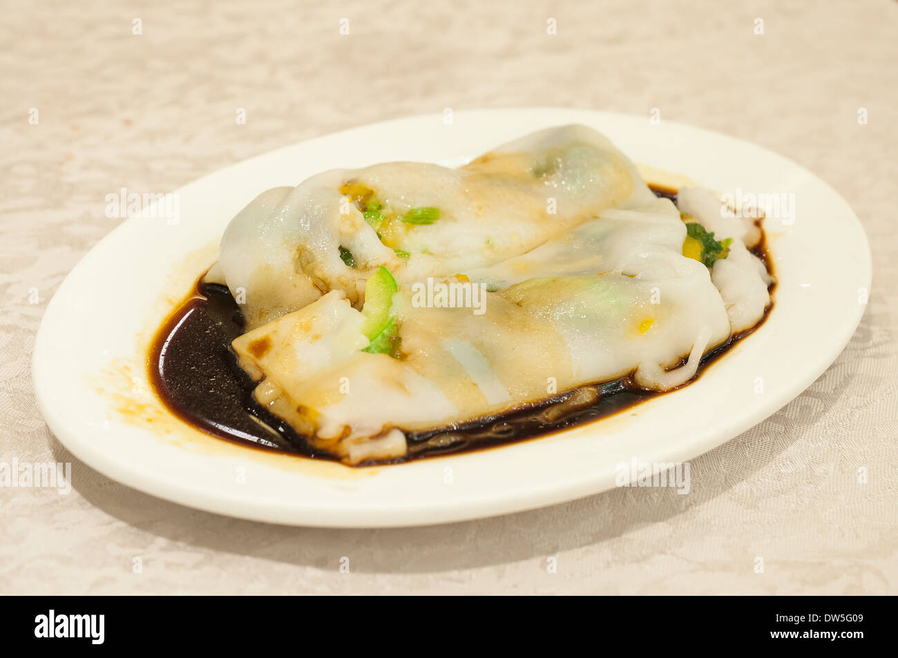 Rice noodles rolls on a plate at Hong Kong dim sum restaurant Stock ...