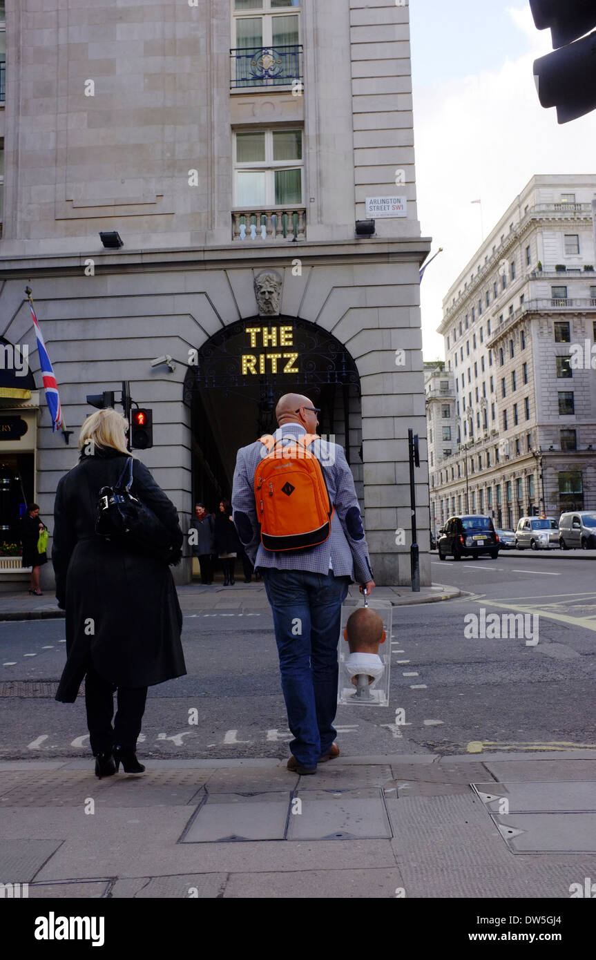 Man carrying a head near The Ritz Hotel, London Stock Photo - Alamy