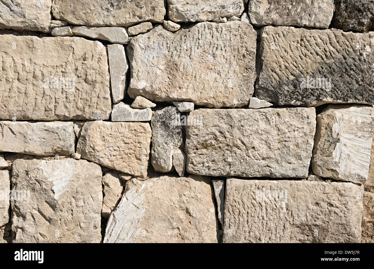 Old weathered stone wall for background Stock Photo - Alamy