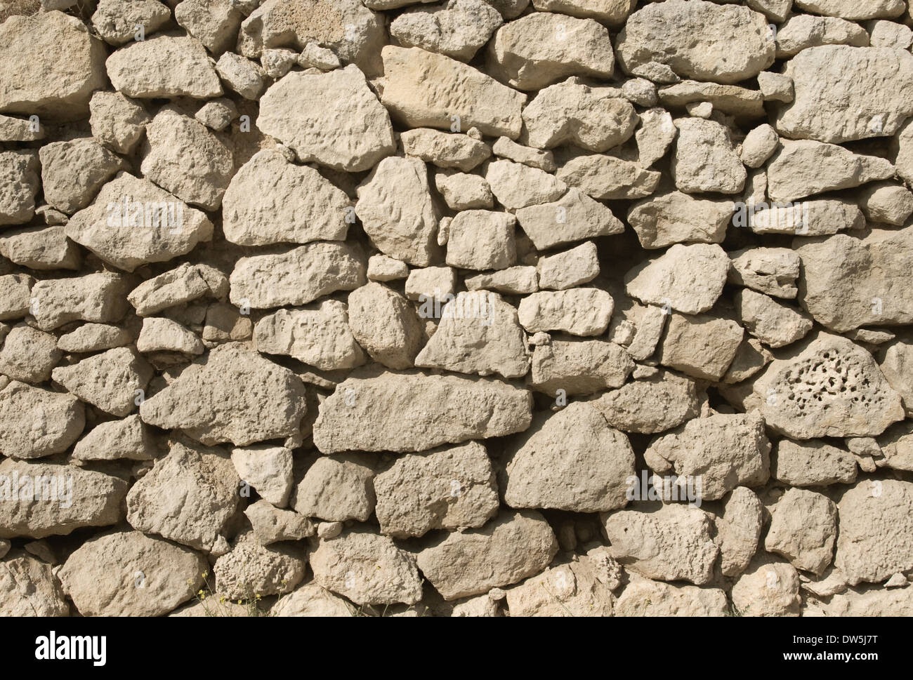 Old weathered stone wall for background Stock Photo - Alamy
