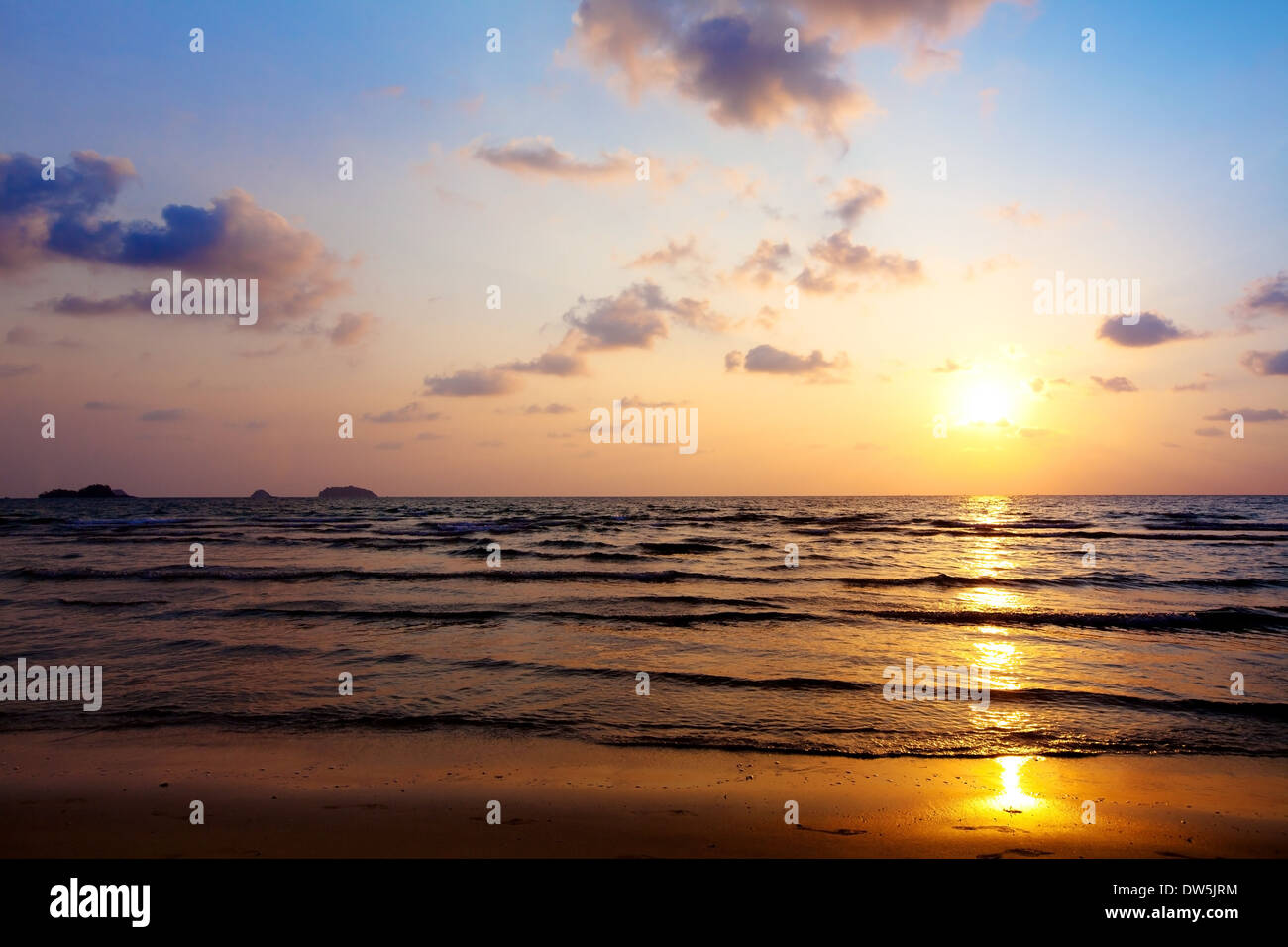 Beautiful sunset on the beach Stock Photo - Alamy