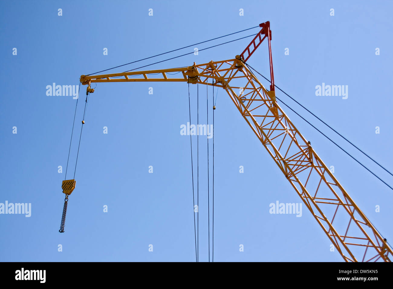 Lifting crane over clear blue sky, view from below Stock Photo - Alamy