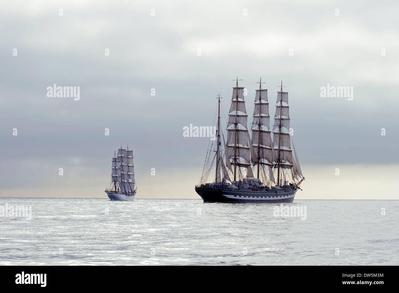 Two tall ships with white sails in the calm sea Stock Photo - Alamy