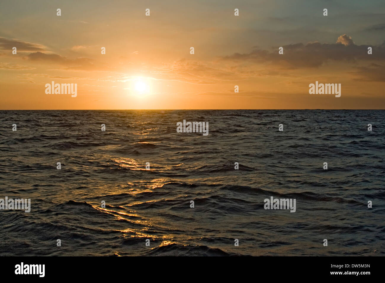 Sun rising over sea sunrise hi-res stock photography and images - Alamy
