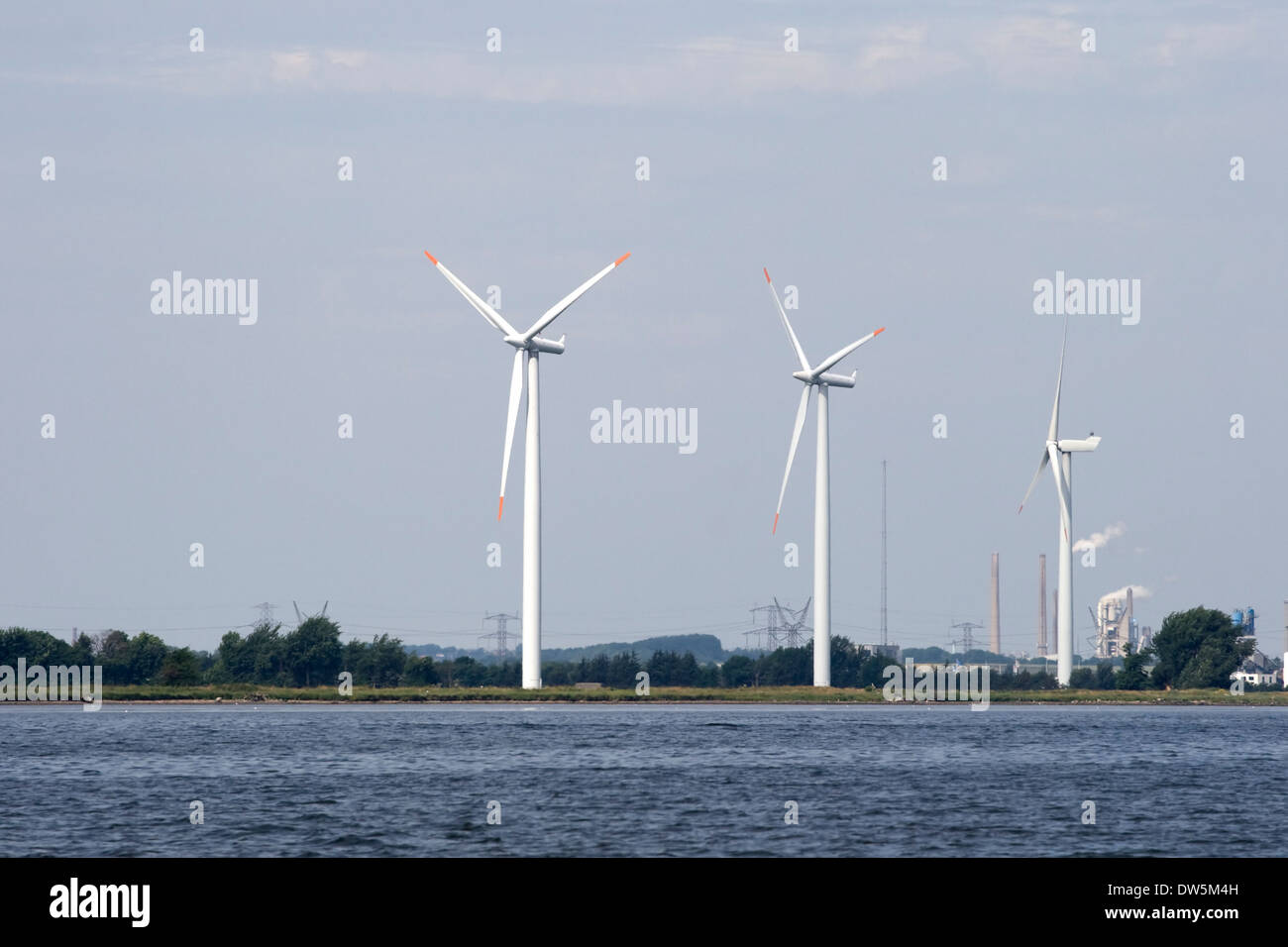 Wind generators on a river coast, Denmark Stock Photo - Alamy