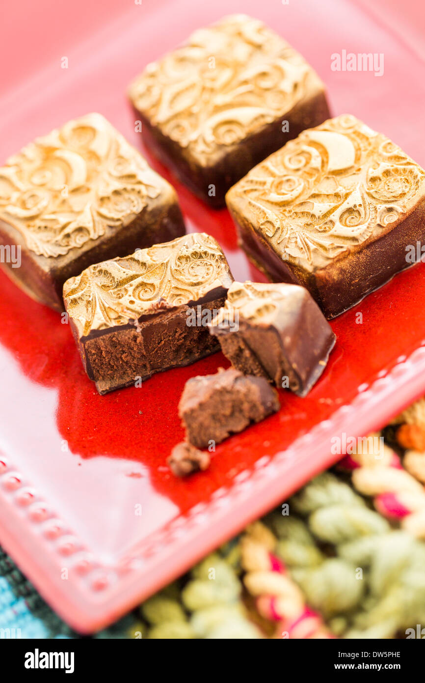 Gourmet Maya spice truffles covered with gold dusting Stock Photo - Alamy