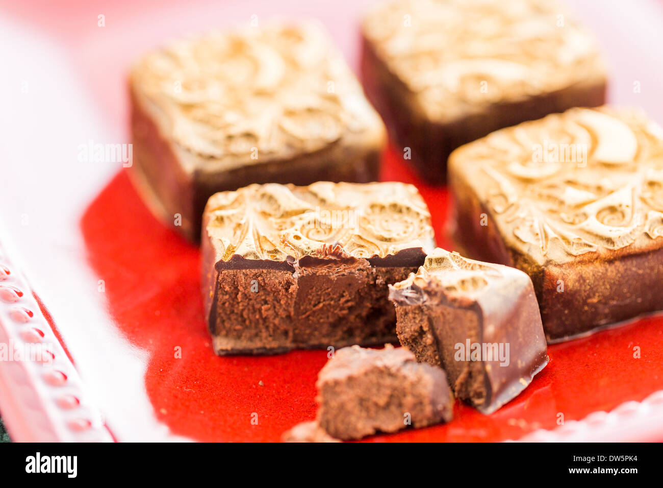 Gourmet Maya spice truffles covered with gold dusting Stock Photo - Alamy