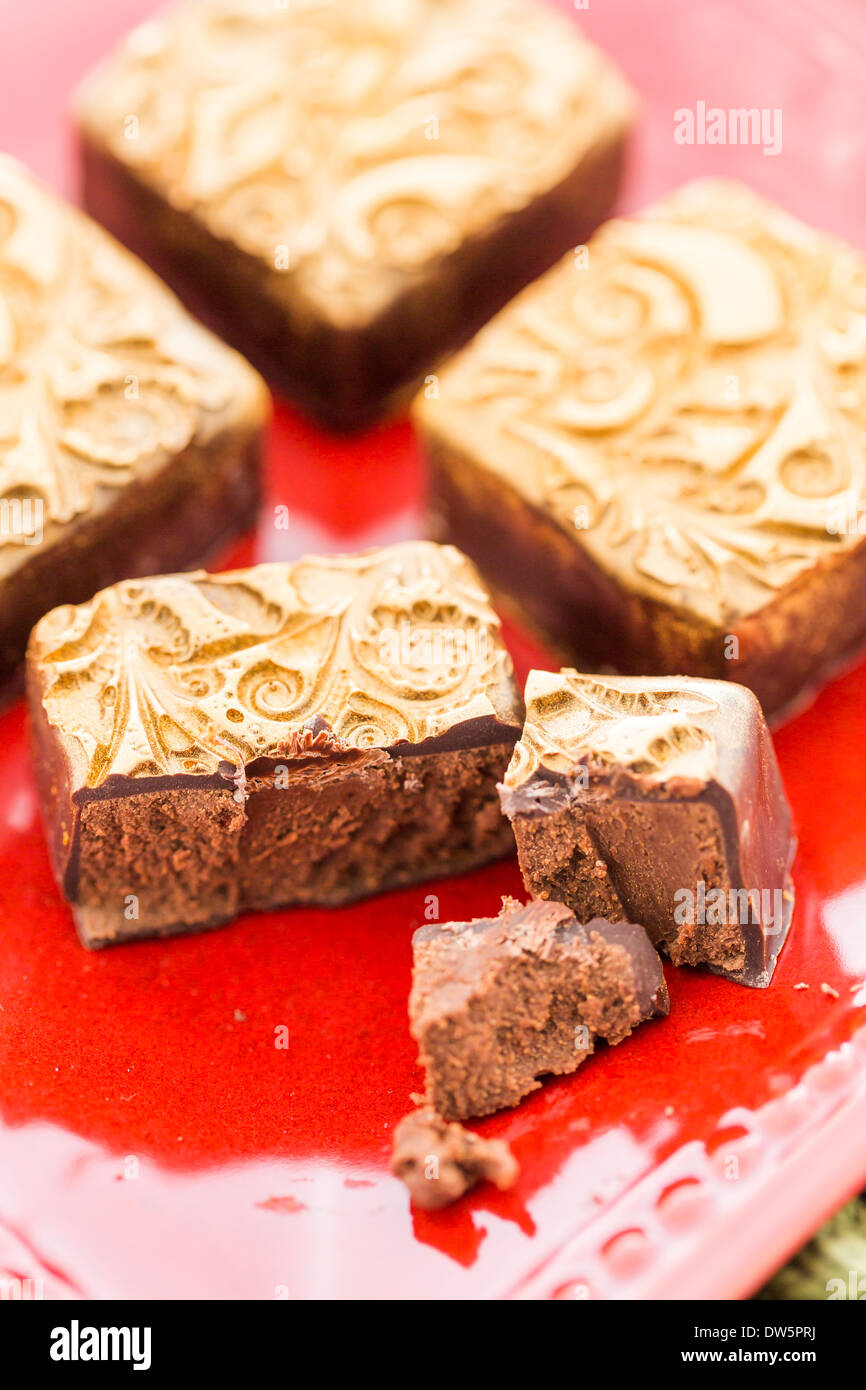 Gourmet Maya spice truffles covered with gold dusting Stock Photo - Alamy