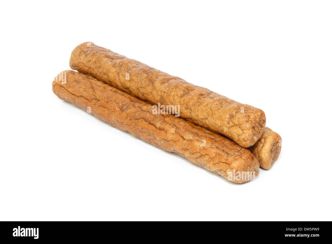 Three frikandellen, a Dutch fast food snack, against white background ...