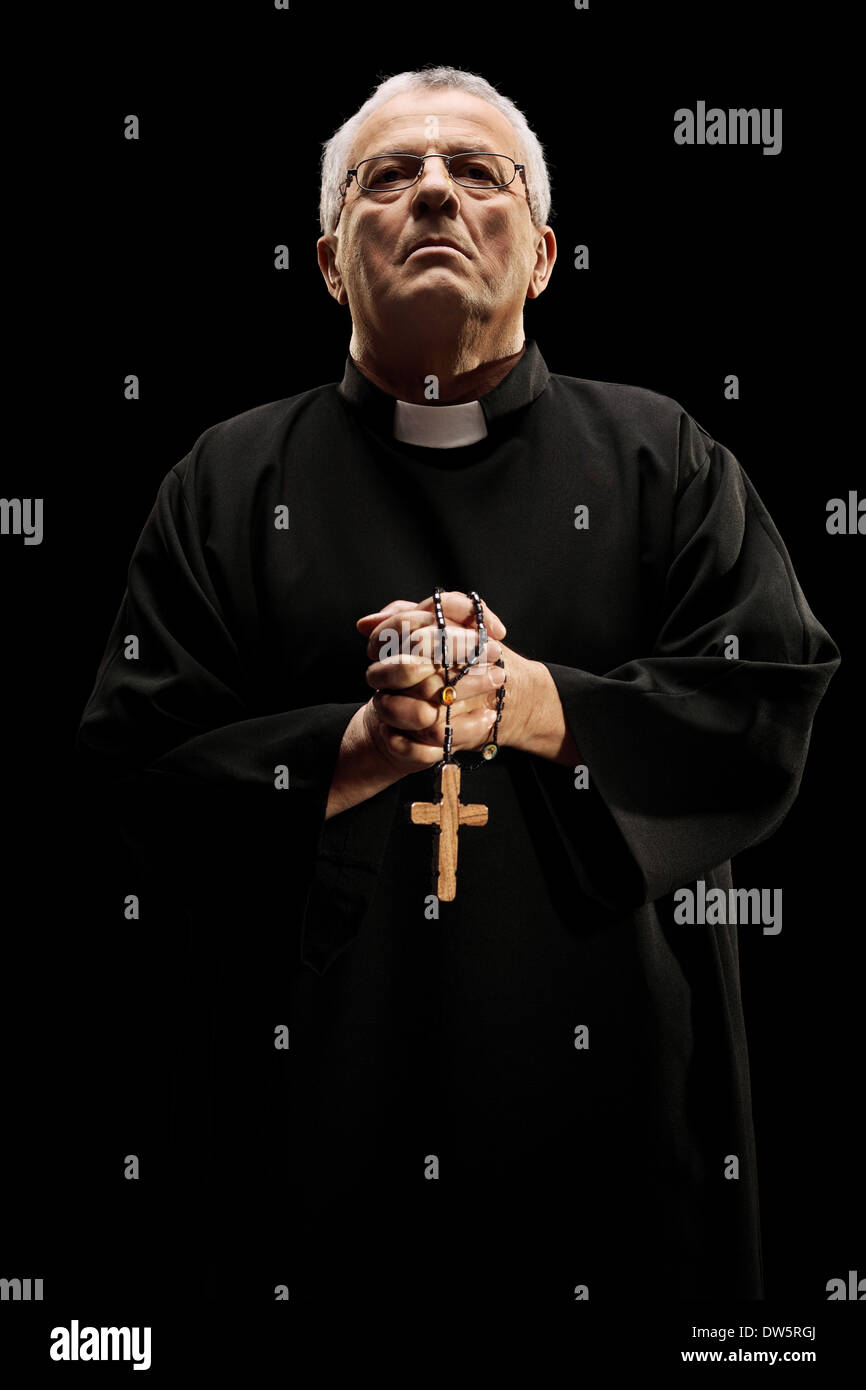 Catholic priest holding cross hi-res stock photography and images - Alamy
