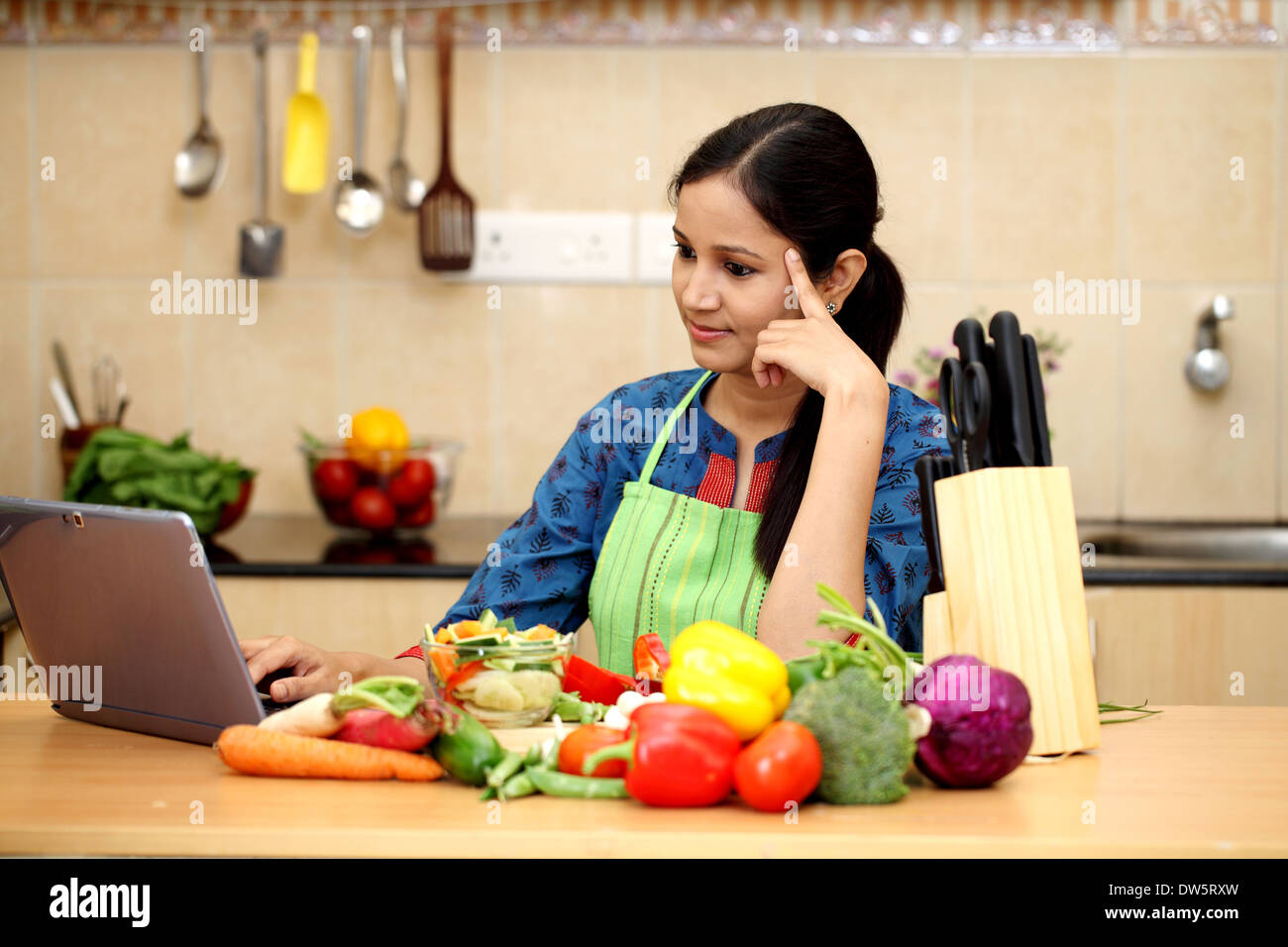 Indian girl using laptop in hi-res stock photography and images - Alamy