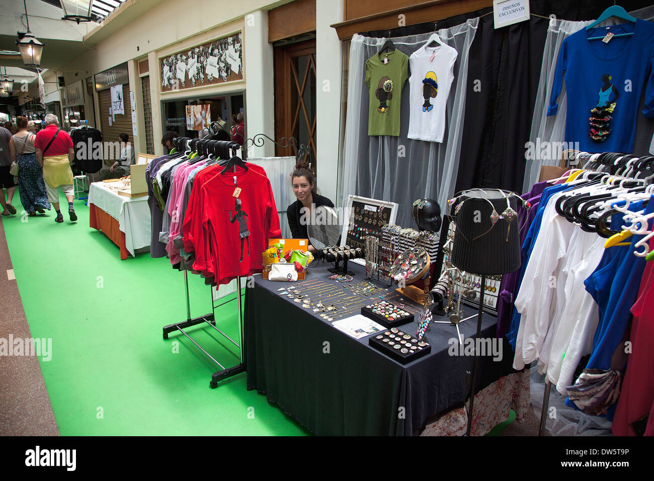 Spain, Catalonia, Barcelona, Craft stalls in small shopping arcade ...