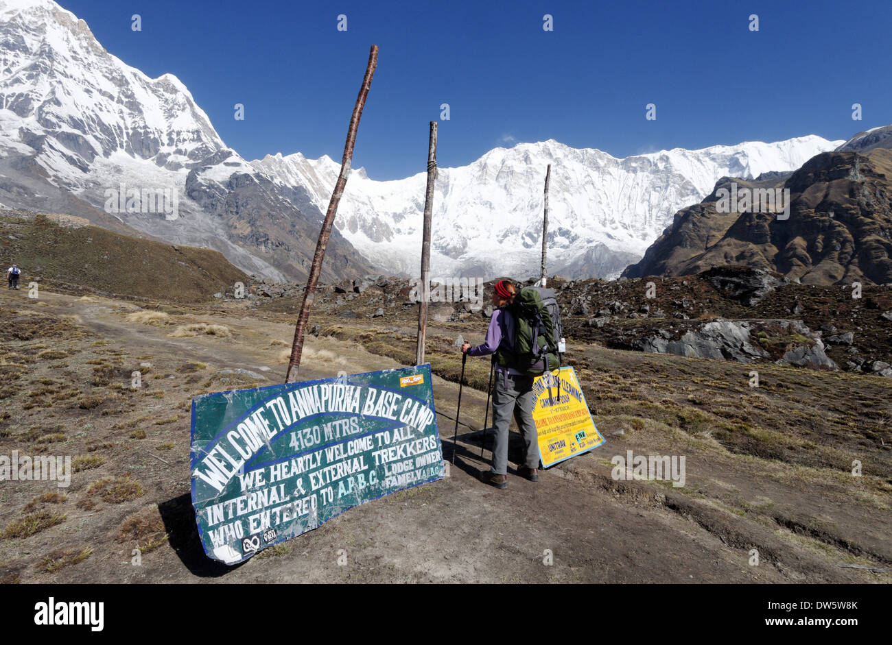 A lady trekker arriving at Annapurna Base Camp in the Annapurna ...