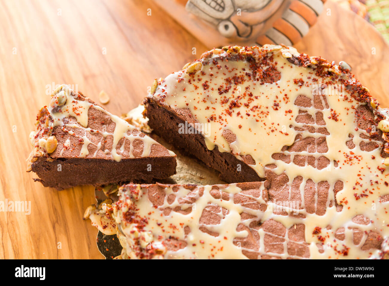 Gourmet Maya Spice torte sliced on a wooden cutting board Stock Photo ...