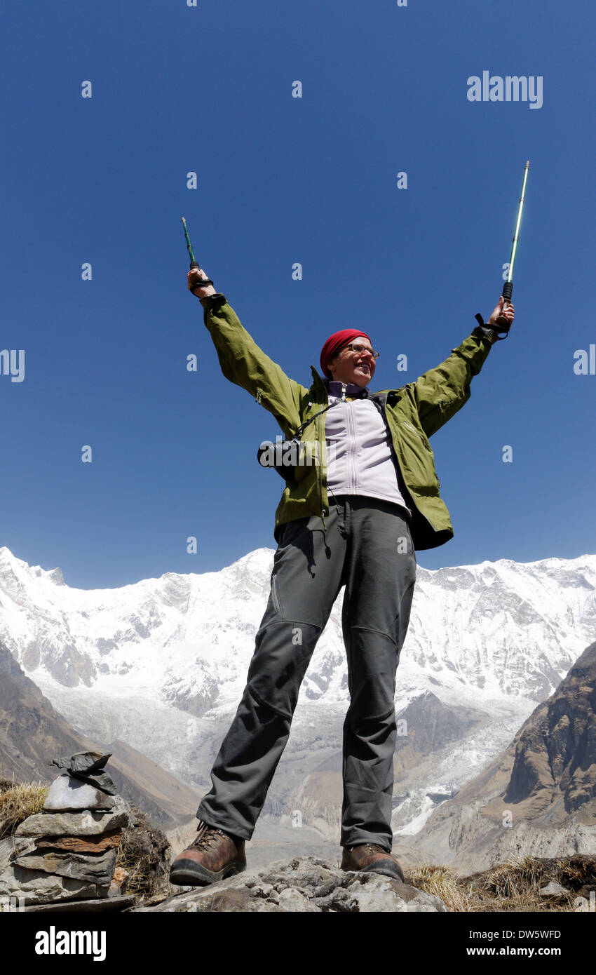 A lady trekker celebrates arriving at Annapurna Base Camp in the ...