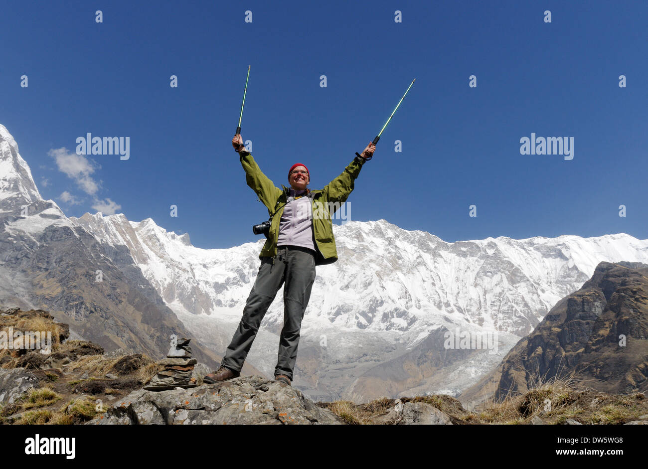 A lady trekker celebrates arriving at Annapurna Base Camp in the ...