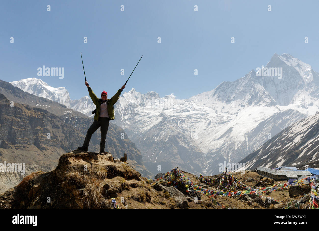 A lady trekker celebrates arriving at Annapurna Base Camp in the ...